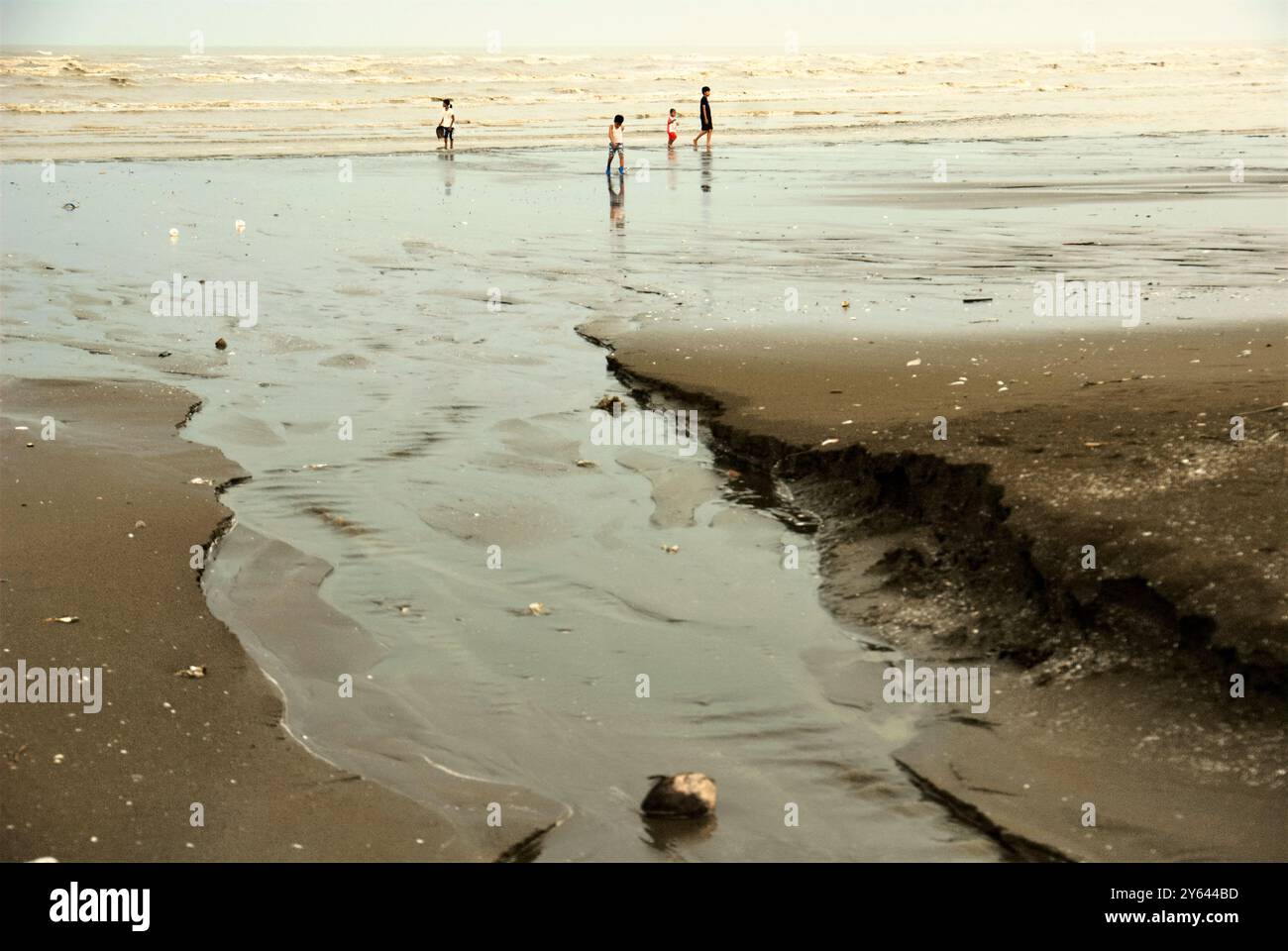 A small stream estuary formed by wastewater from a sewage on Pakis ...