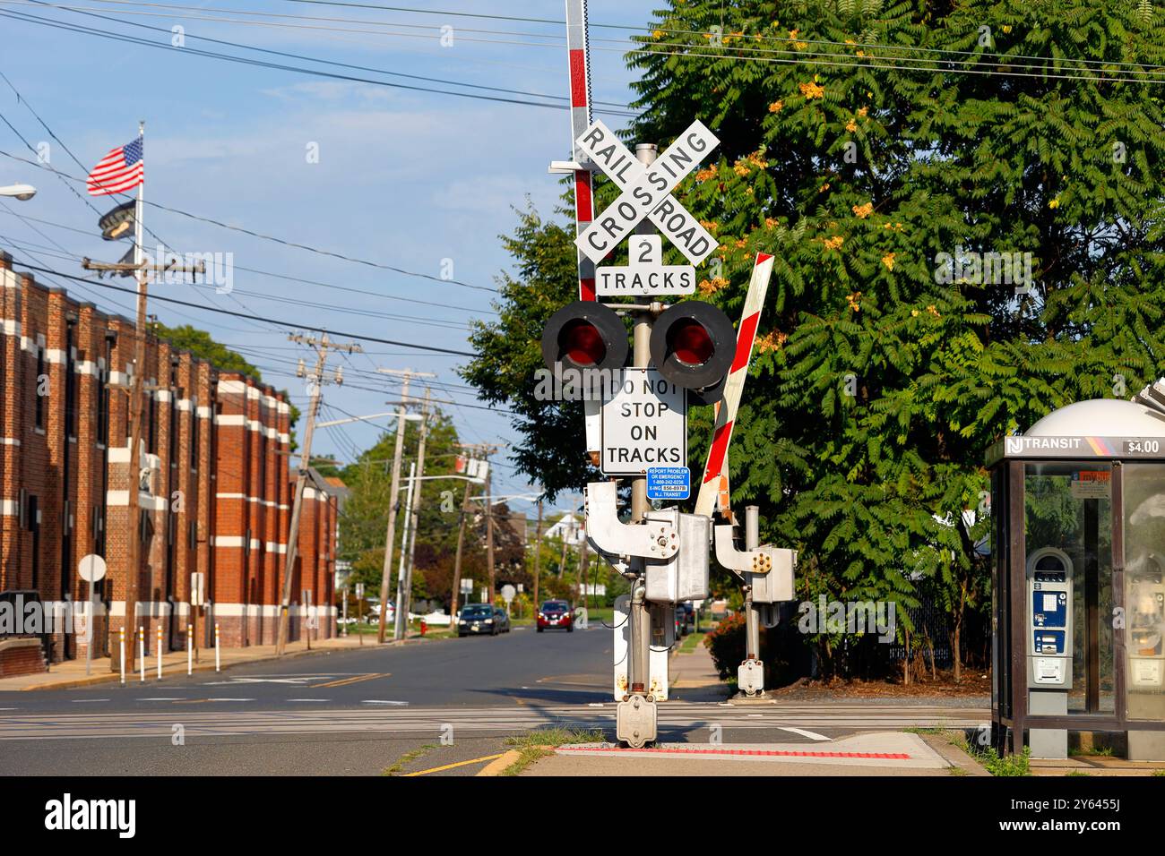 A railroad crossing gate for two tracks with a "Do Not Stop on Tracks ...