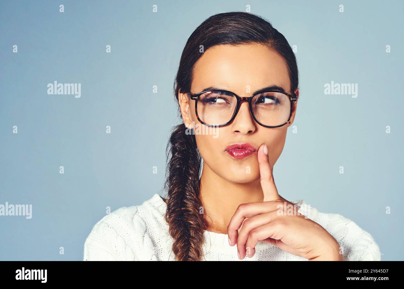 Ideas, glasses and woman with question in studio for future, vision or ...