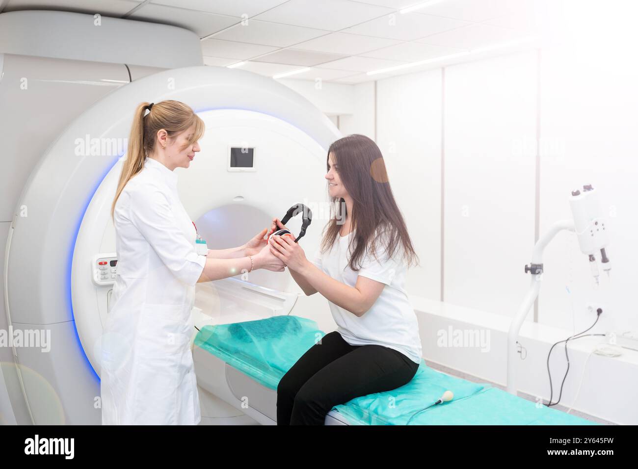 Female patient undergoing MRI - Magnetic resonance imaging in Hospital ...