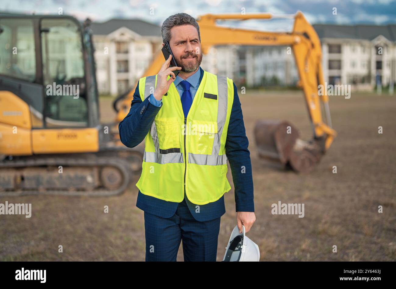 Successful construction business owner. Construction worker in suit and ...