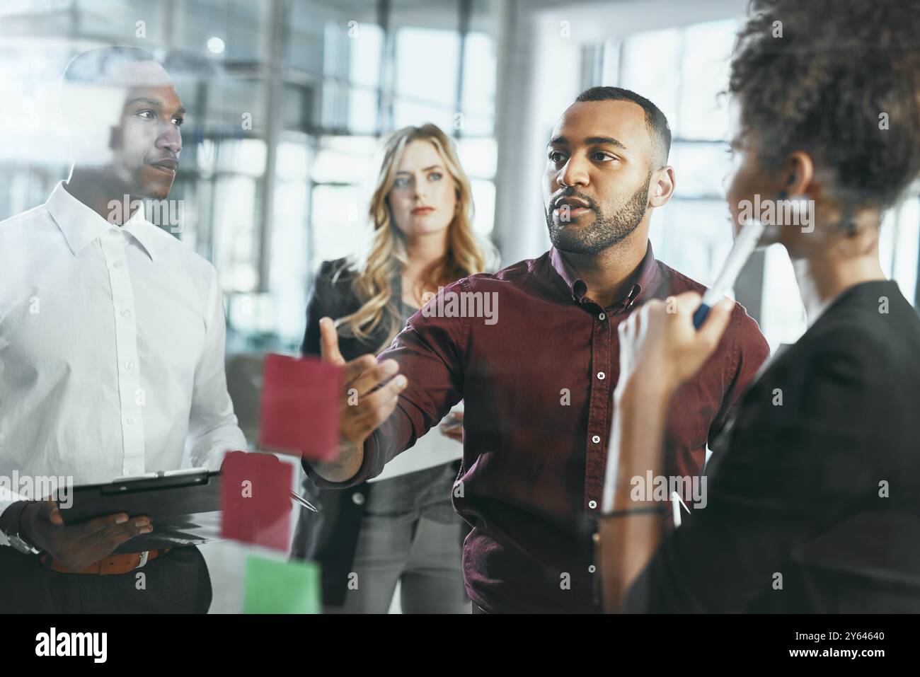 Sticky notes, glass and discussion of people, office and collaboration ...