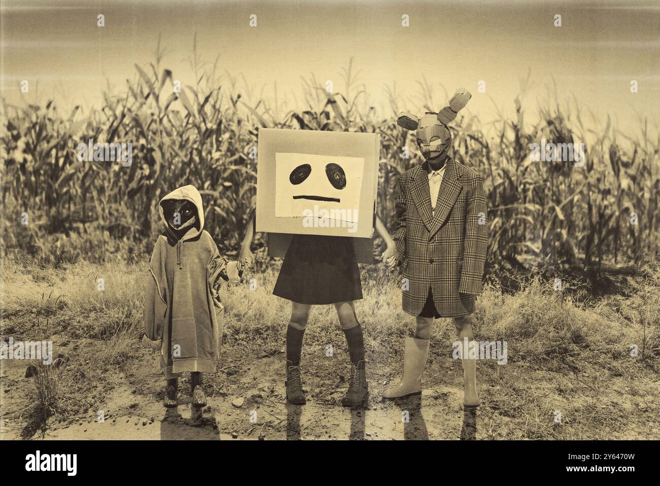 Three mysterious figures, wearing creepy masks and odd clothes, holding ...