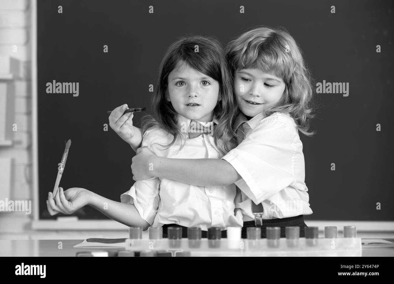 Portrait school kids hugging. Children drawing on elementary school ...