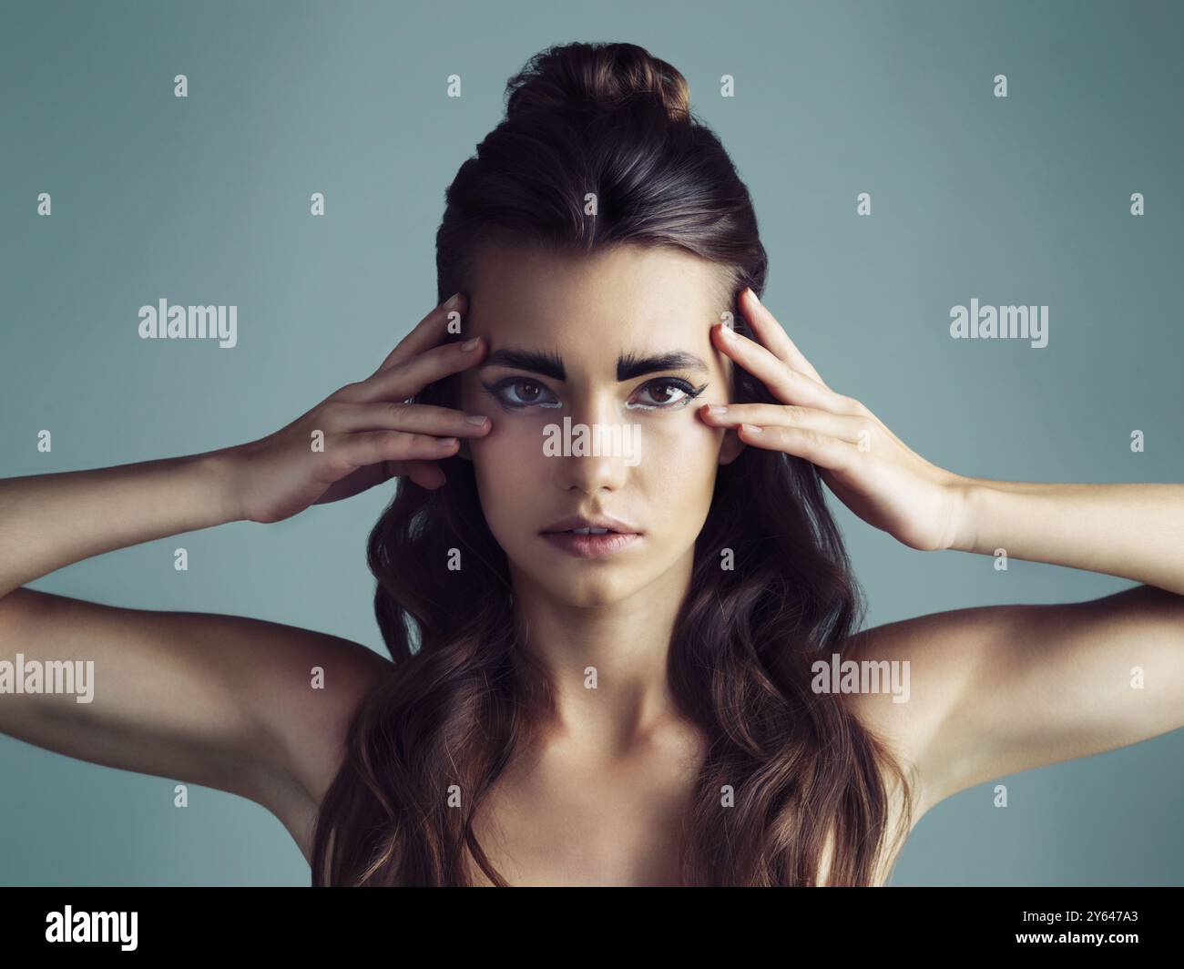 Studio, portrait and woman with makeup, mascara and cosmetics for ...