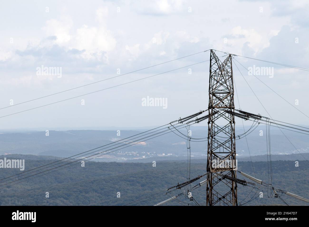 High voltage line tower. Lamppost in cloudy or foggy sky. Energy ...