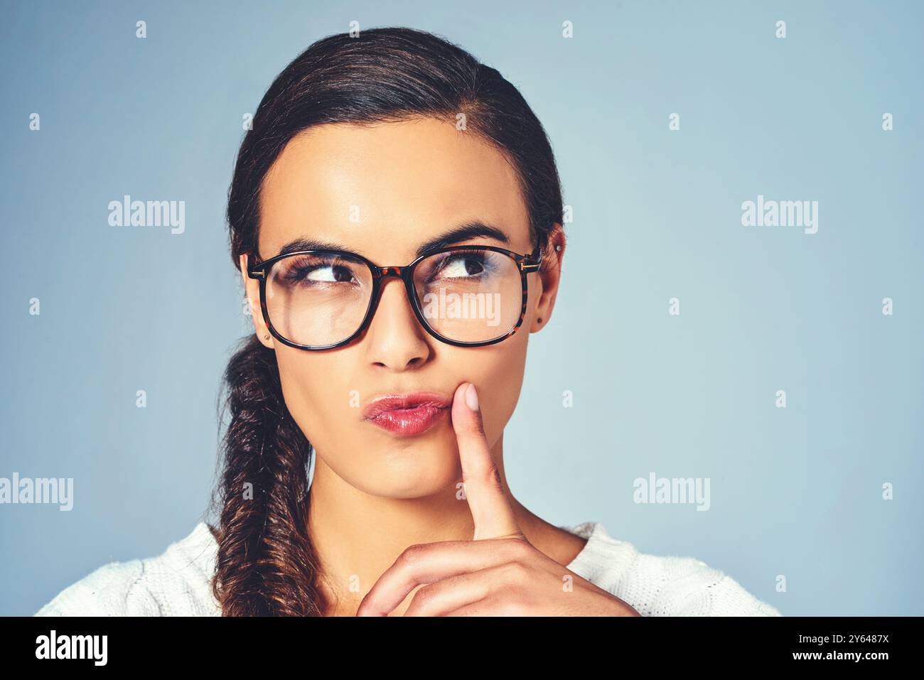 Thinking, glasses and woman with question in studio for future, vision ...