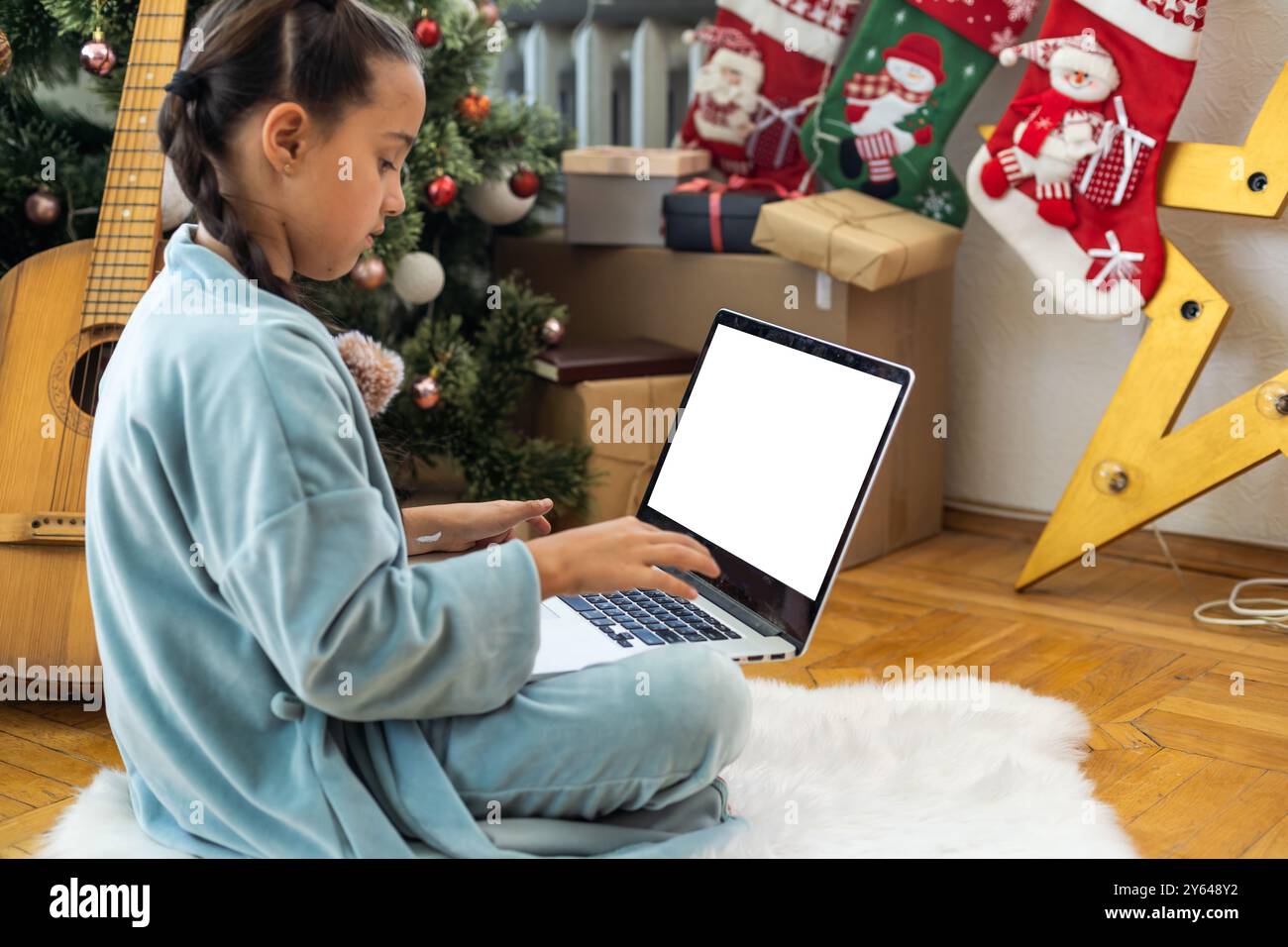 Christmas distance learning online education. Schoolgirl studying at ...