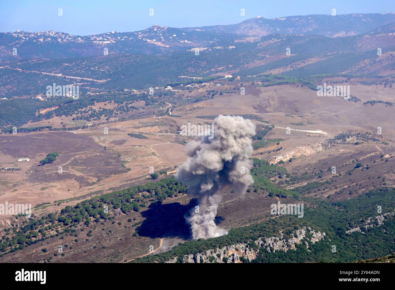 Smoke rises from an Israeli airstrike on the Mahmoudieh mountain, as ...