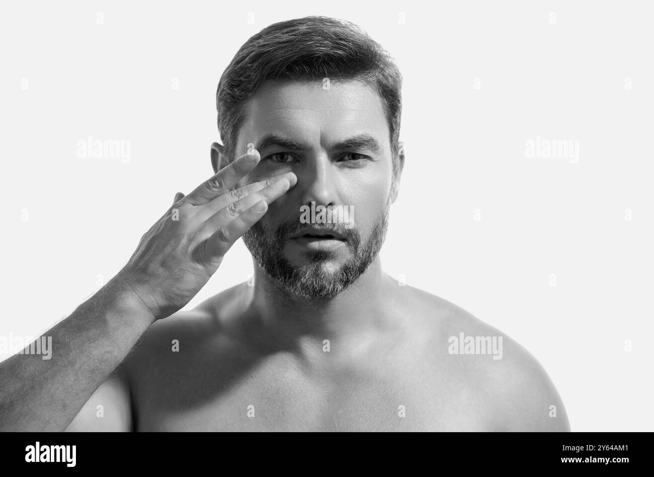 Satisfied man touching face beard Black and White Stock Photos & Images ...