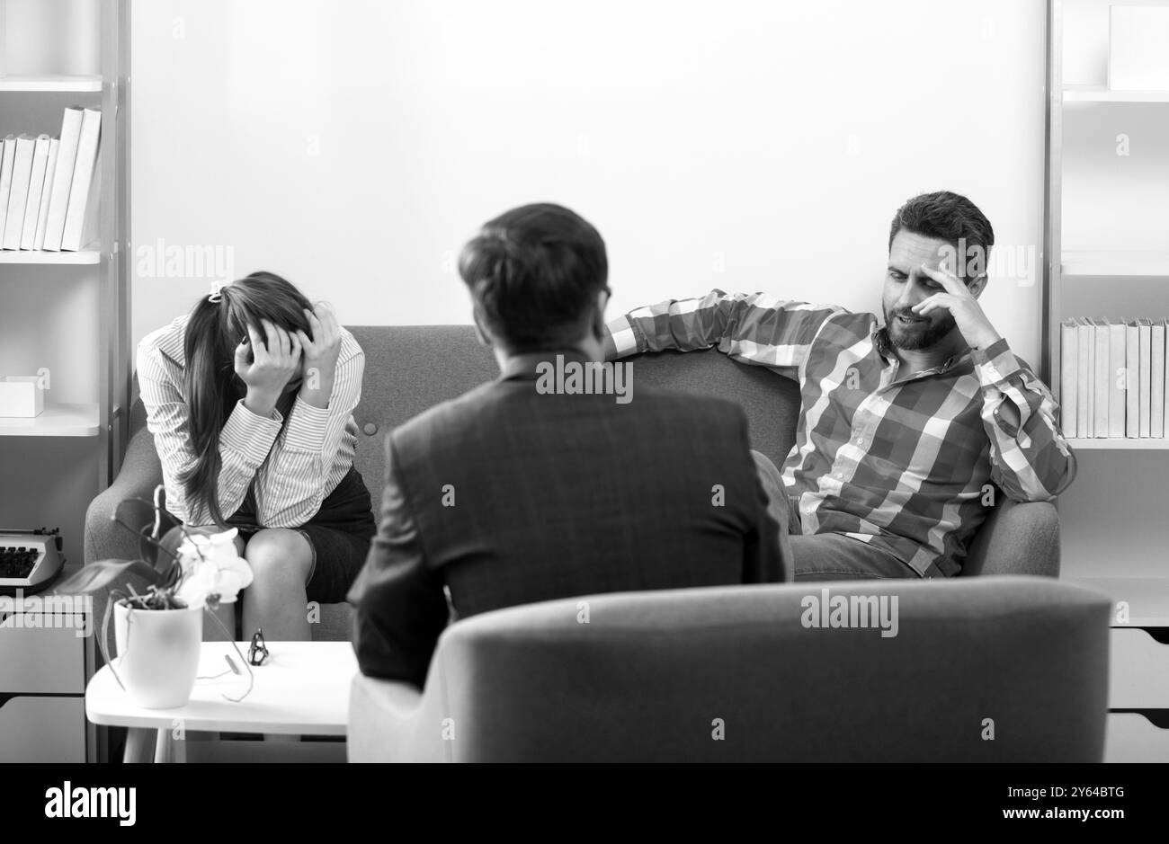 Psychological couple problem. Social worker psychologist talking to ...