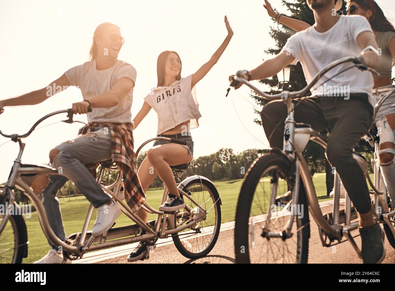Life is awesome! Two young modern women giving each other high five ...