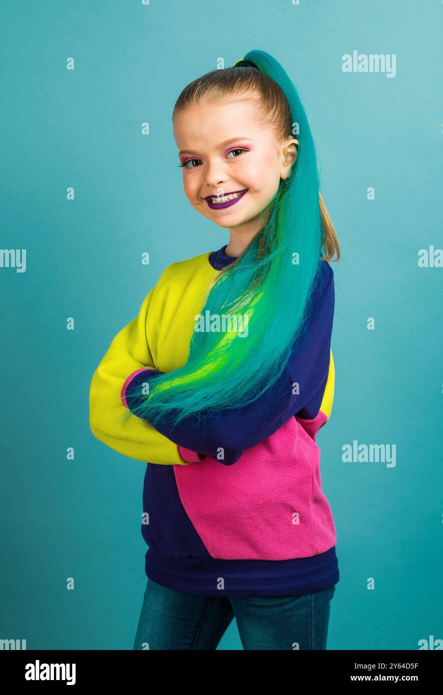 Beauty fashion model kid girl with colorful dyed hair. Girl with ...