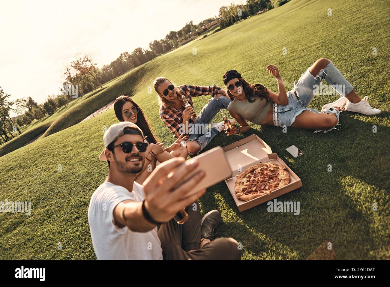 Creating happy memories. Group of young smiling people in casual wear ...