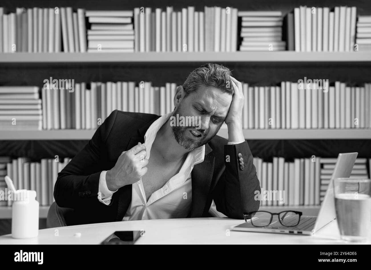 Aged man in glasses uses Black and White Stock Photos & Images - Alamy