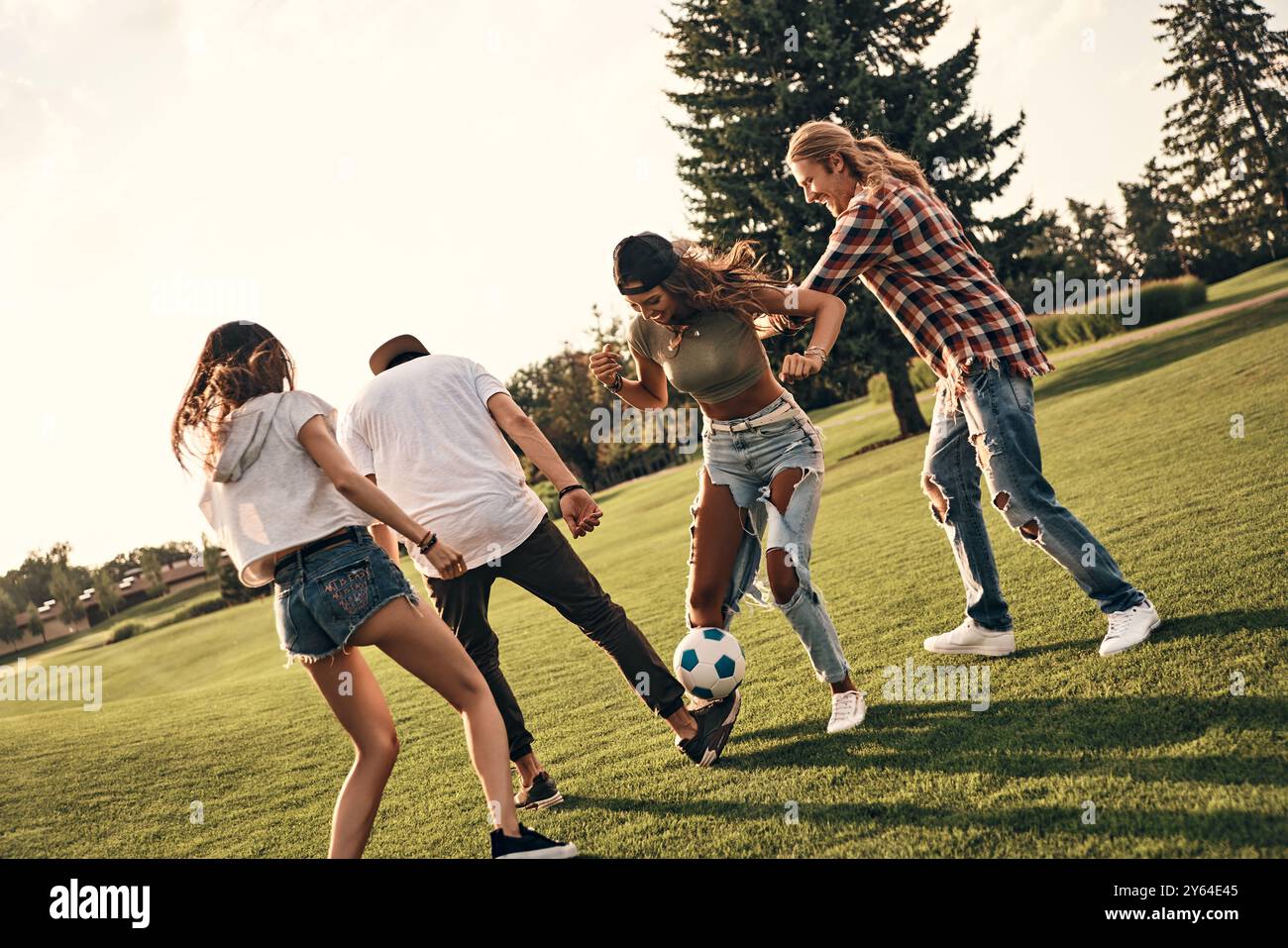 Best way to spend the weekend. Group of young smiling people in casual ...