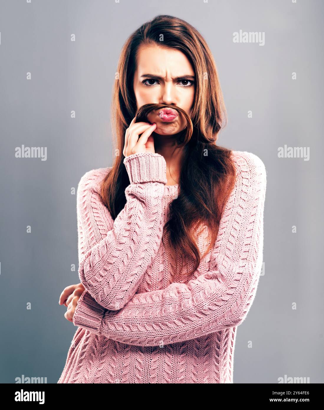 Woman, portrait and mustache with hair in studio for haircare, damaged ...
