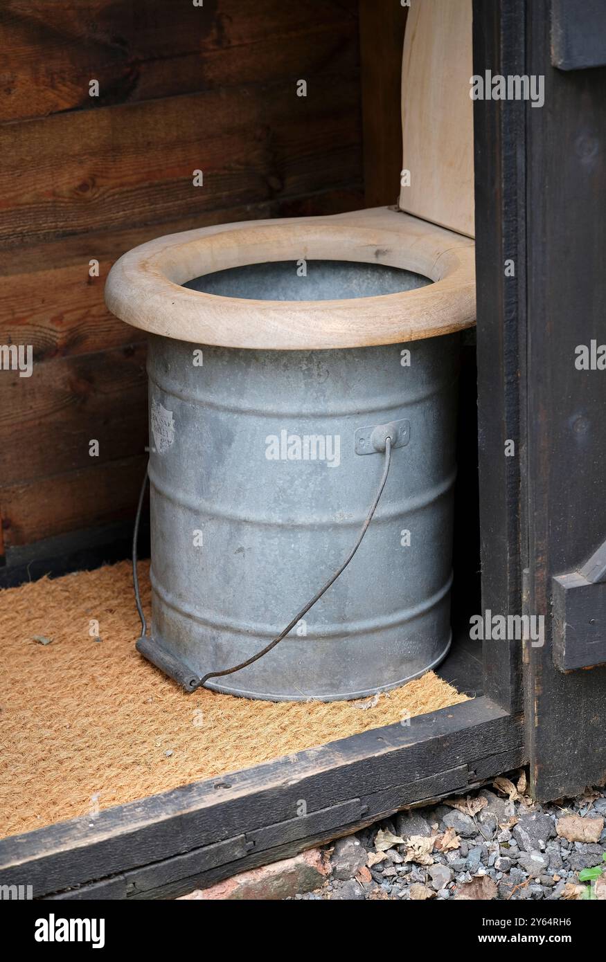 outdoor galvanised metal toilet in garden shed Stock Photo - Alamy