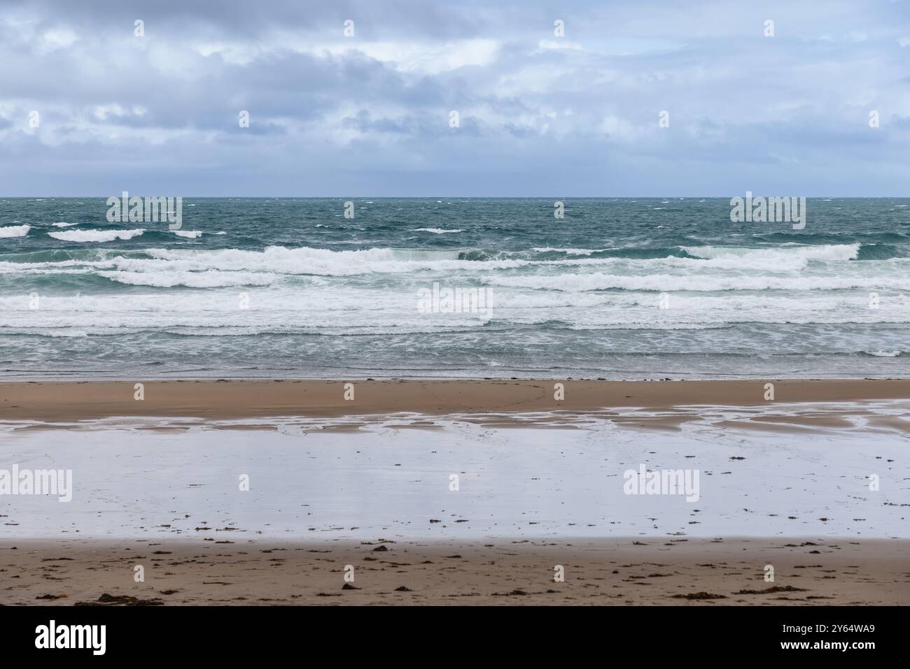 Three layer beach scene at Strandhill, Ireland, shows wet sand ...