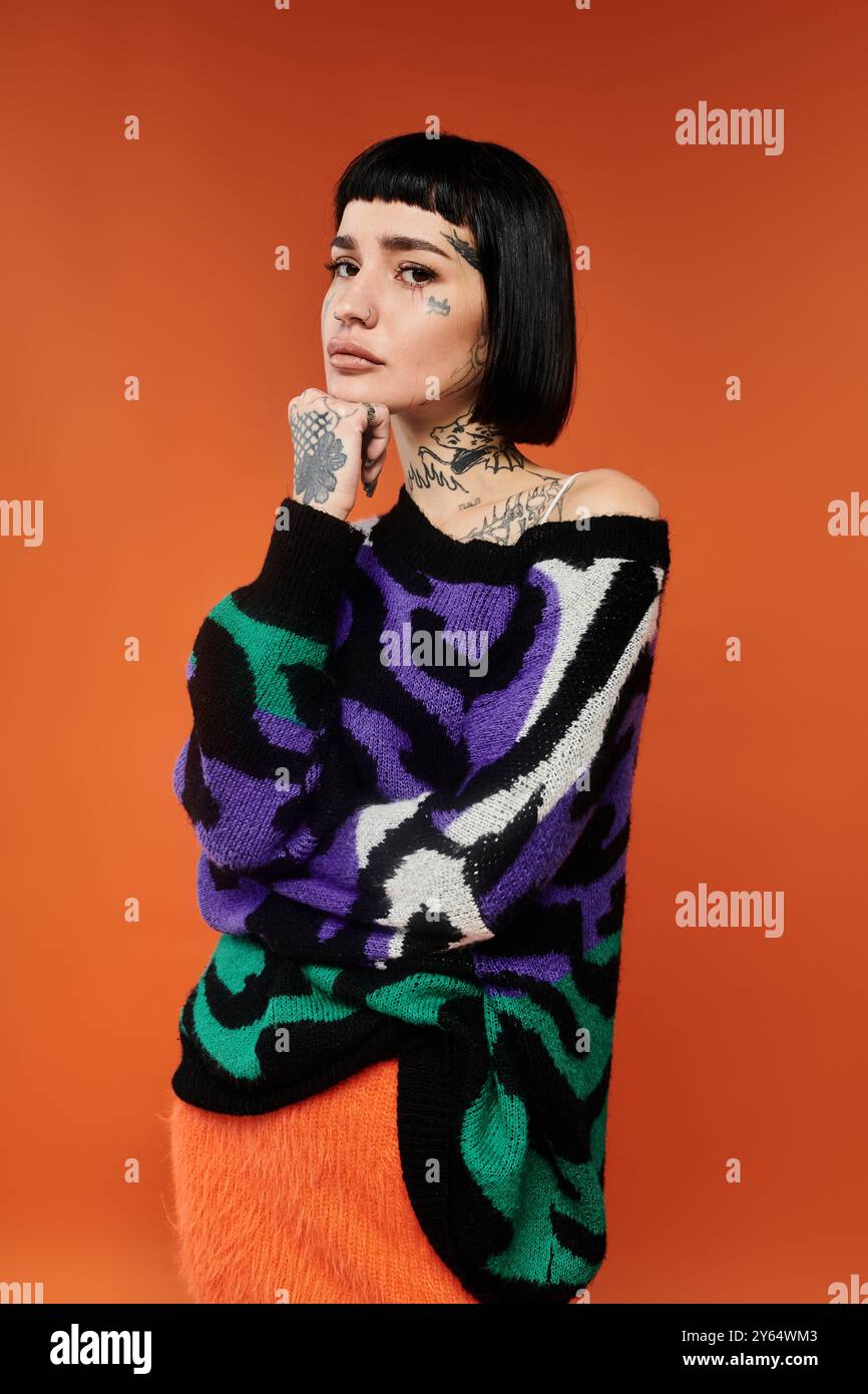 A young woman poses confidently, showcasing her tattoos and vibrant ...
