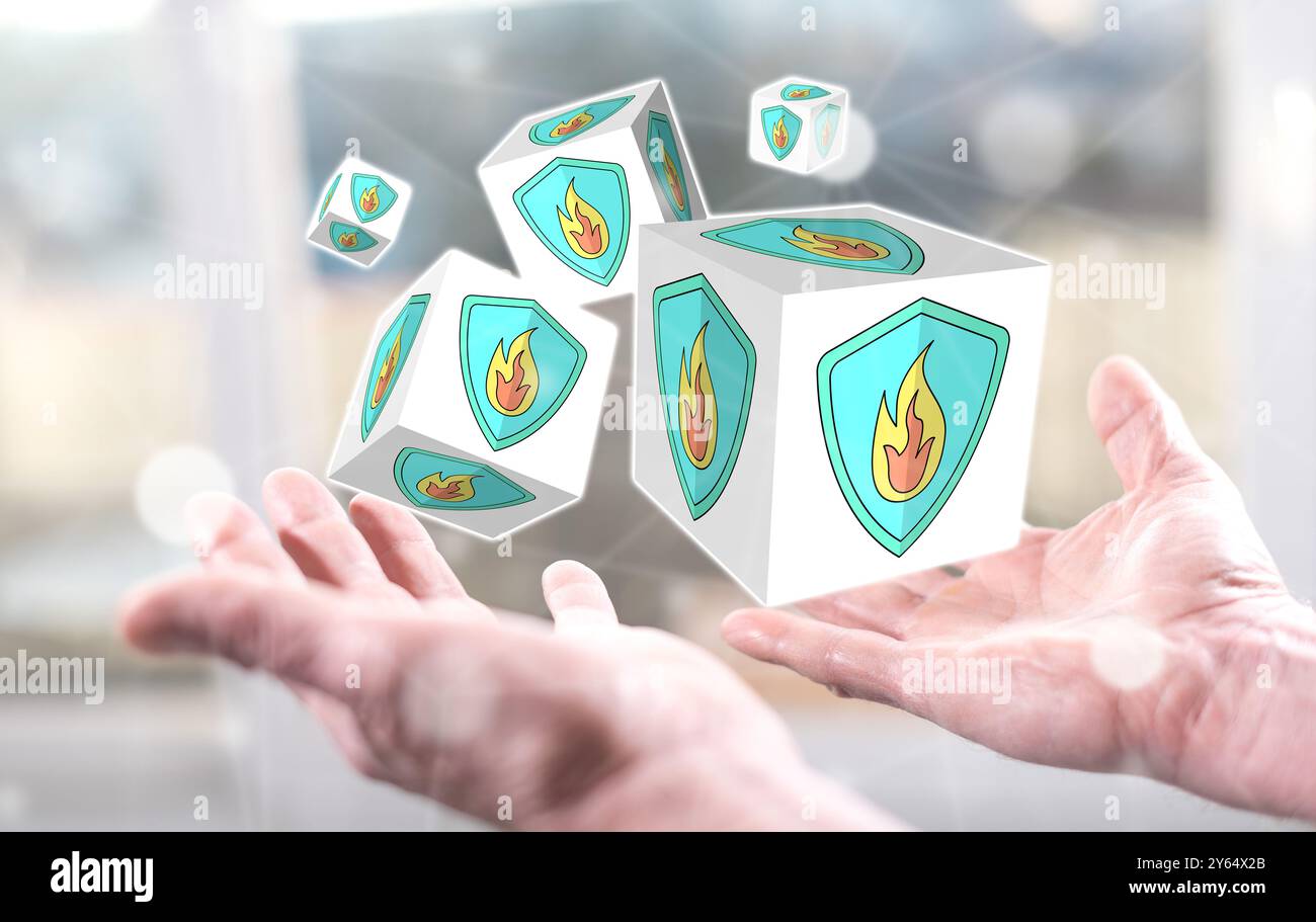 Fire protection concept above the hands of a man Stock Photo - Alamy