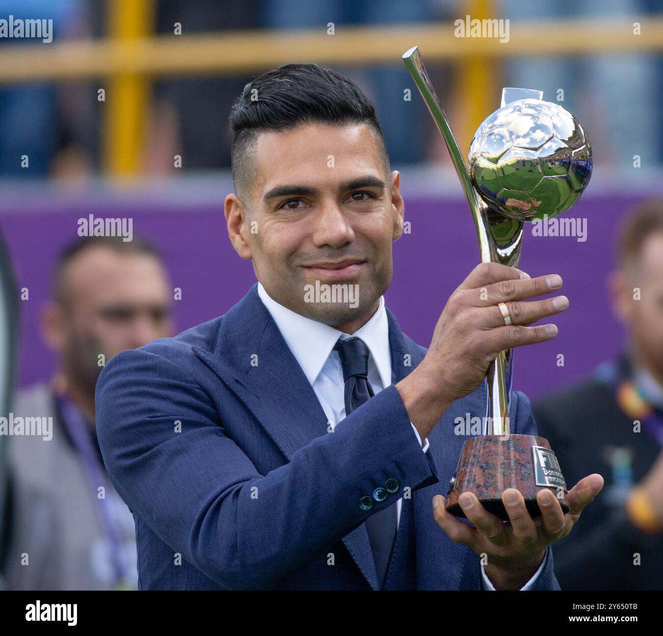 Colombian footballer Radamel Falcao holds the winner's trophy prior to ...