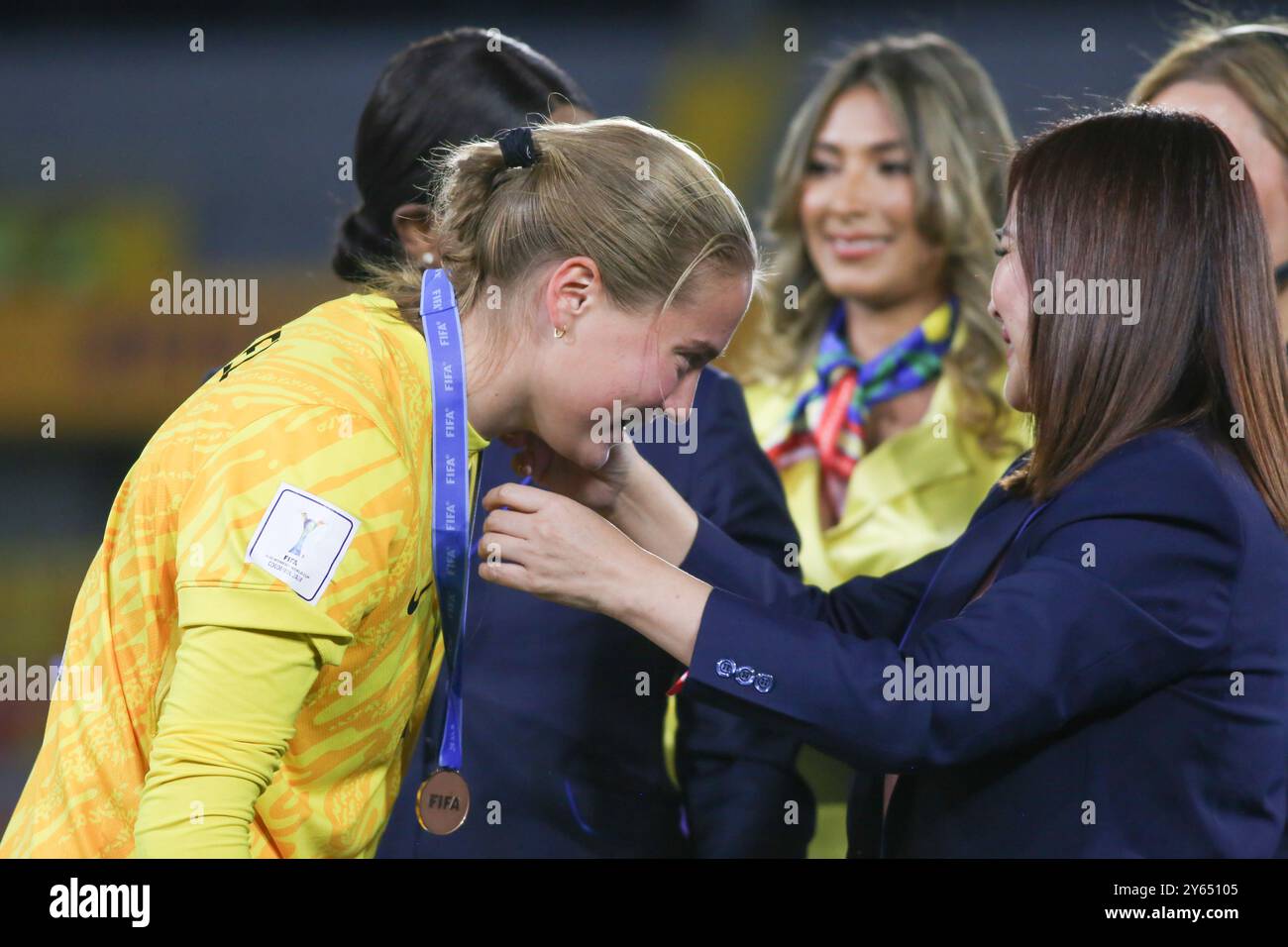 Caroline Nicole Birkel of the United States receives the third-place ...