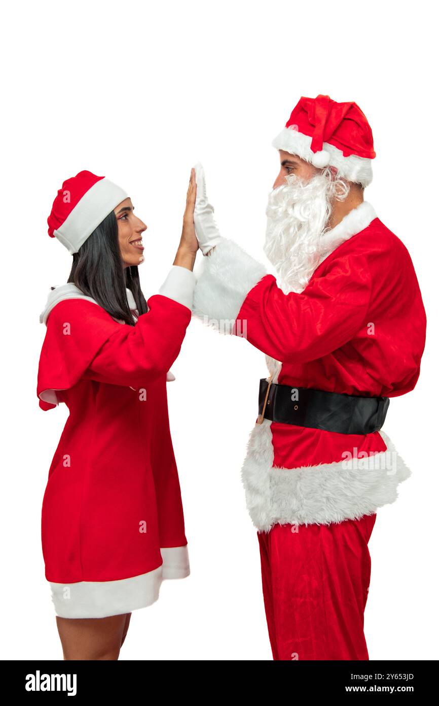 vertical Santa Claus and his wife are joyfully high-fiving each other ...