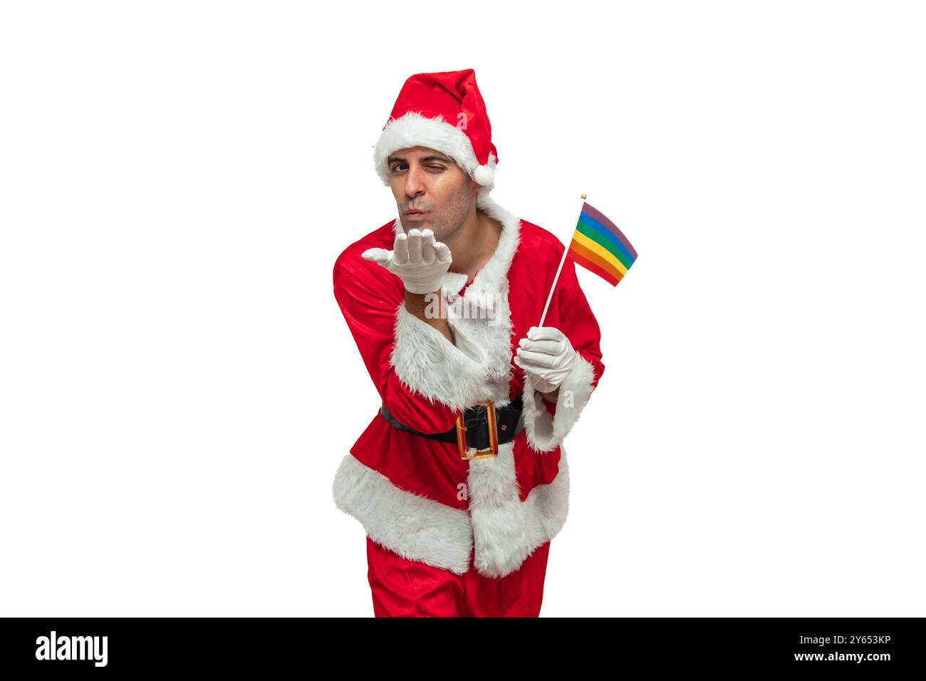 cheerful gay man in a Santa Claus outfit playfully blows a kiss towards ...