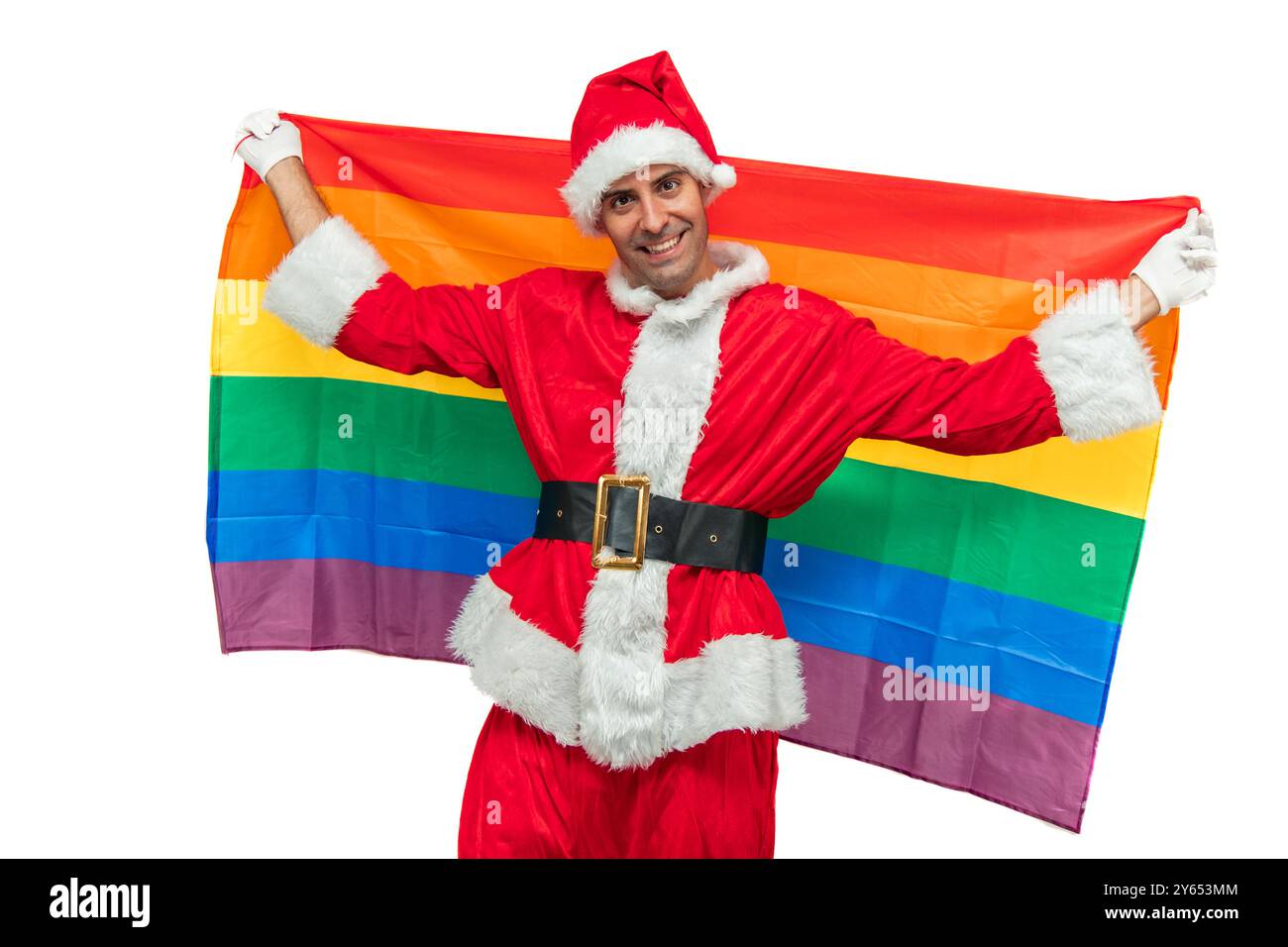 oyful gay boy in a Santa Claus costume proudly holds a large rainbow ...
