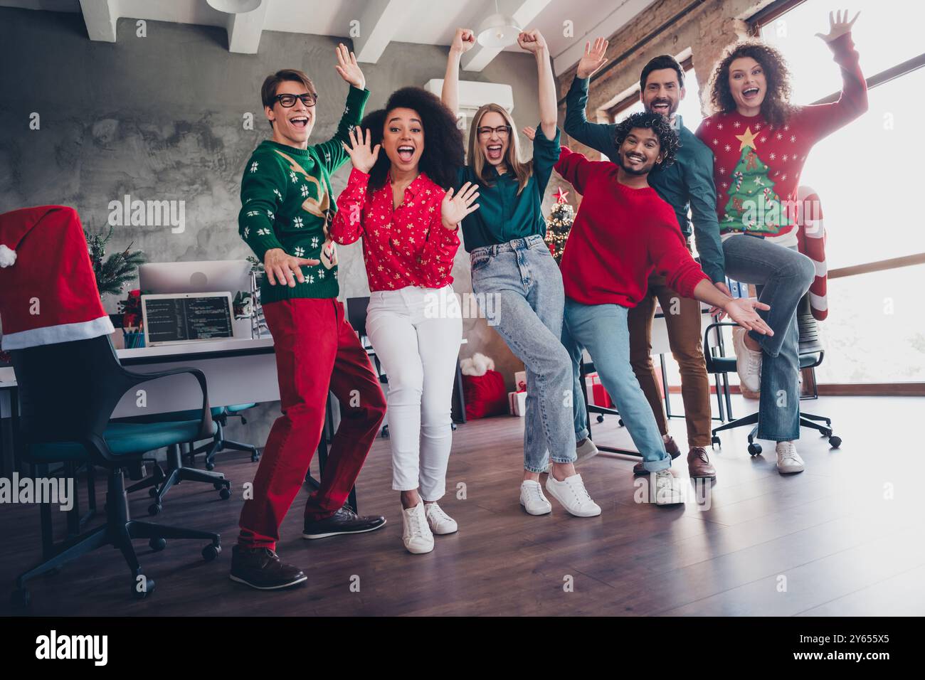 Full size photo of young people team employees raise hands cheerful ...