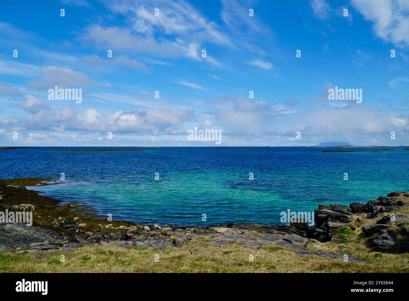 Vibrant blue waters and rocky shores of an archipelago on the island of ...