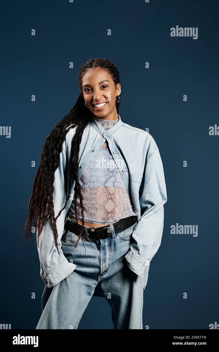 A confident young woman poses gracefully, showcasing her unique style ...