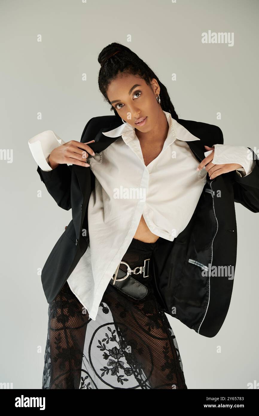 A young woman expresses her unique style with confidence while posing ...