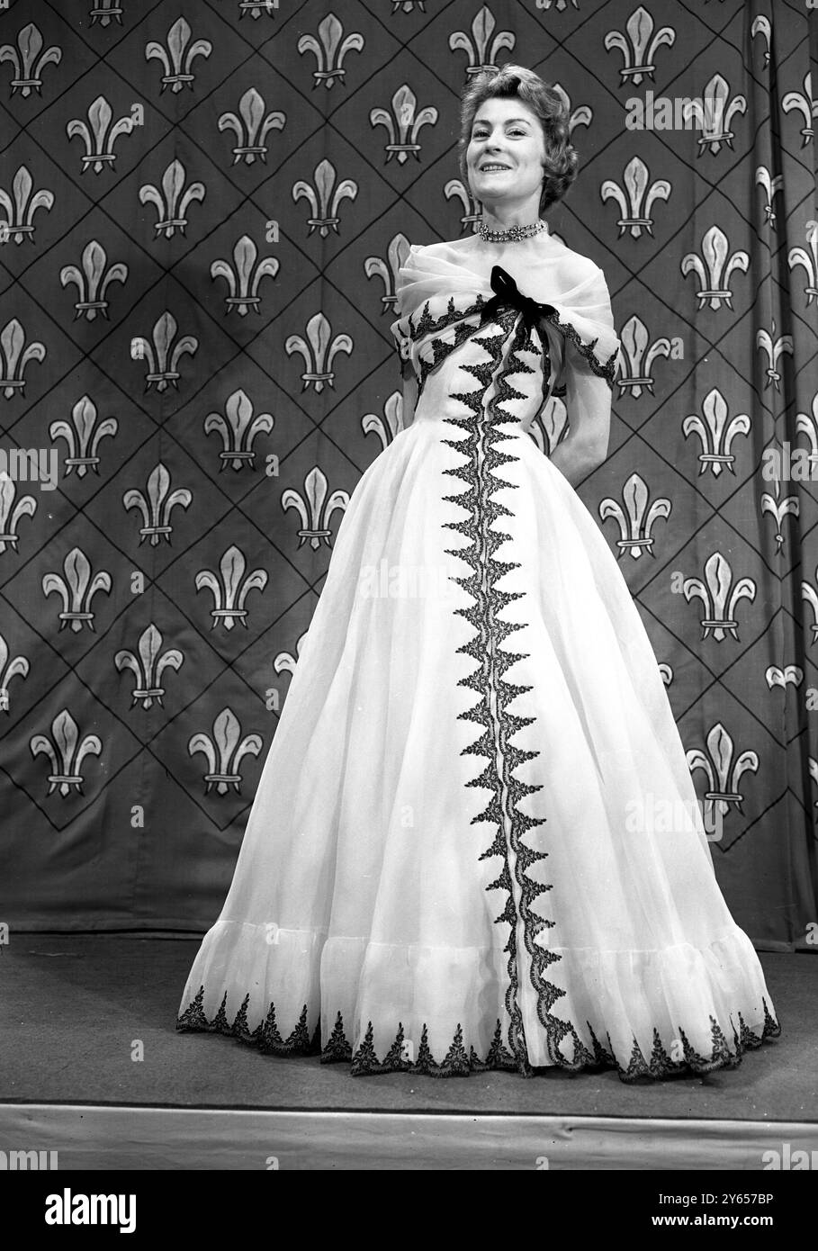 Lina modelling White Serenade , an evening gown by Schiaparelli at an ...
