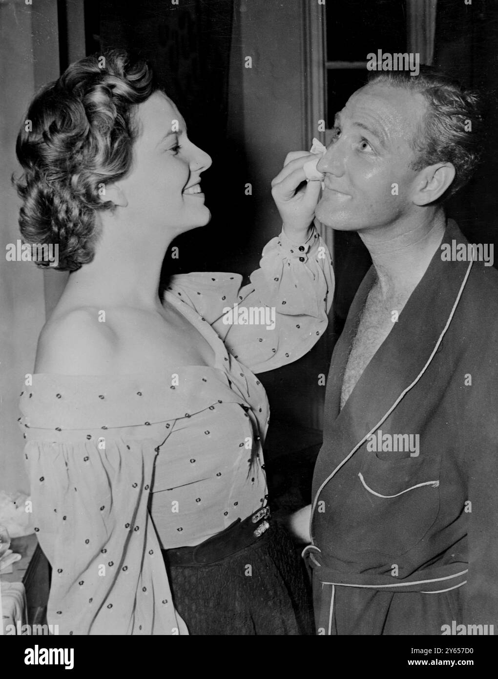 TV star Pat Cutts , wipes off the greasepaint for her co-star Leslie ...