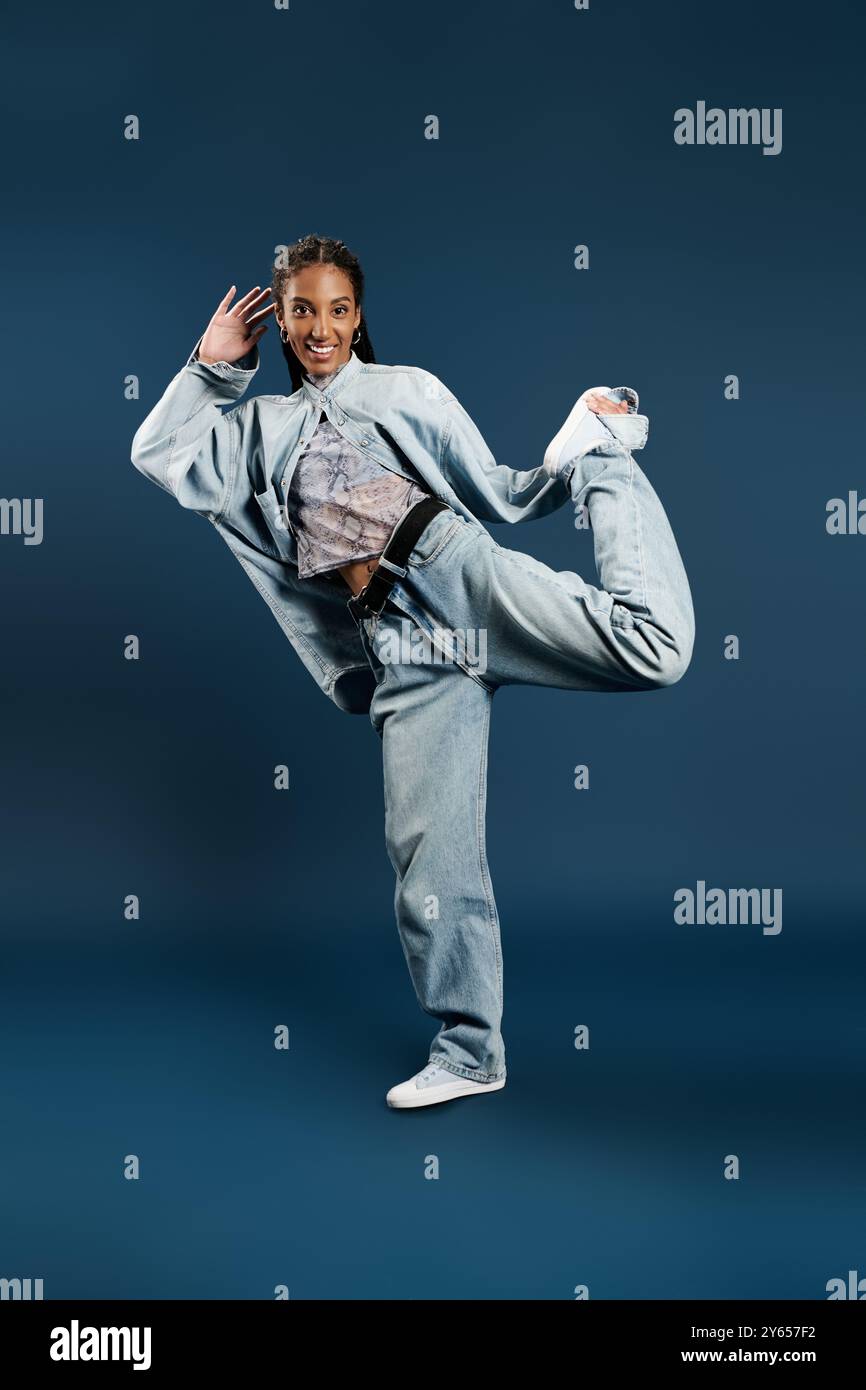 A confident young woman shows off her unique style in a playful pose ...