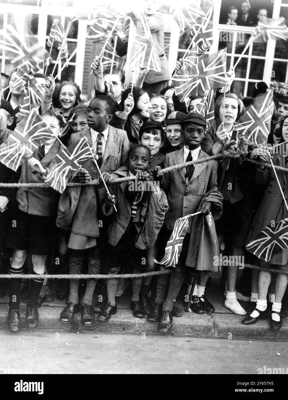 Three coloured children waving flags are among the twelve hundred ... Three coloured children waving flags are among the twelve hundred ...