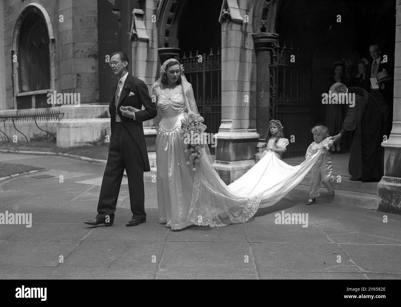 The wedding of Mr John Wyndham and Miss Wyndham Quin The verger assists ...