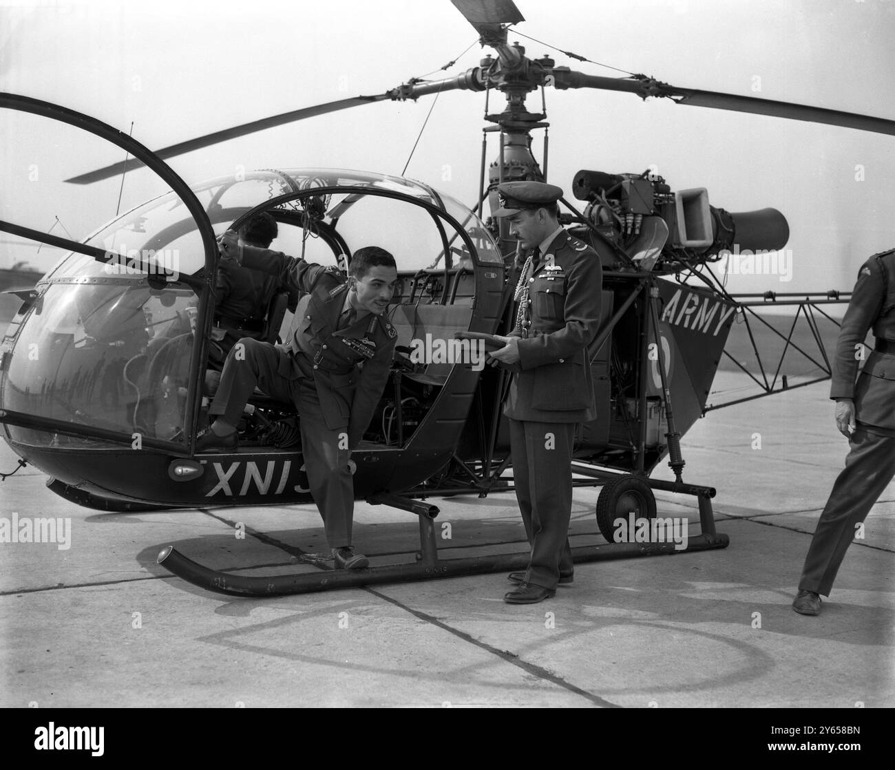 Young King Hussein of Jordan leaves a French helicopter Alouette on ...