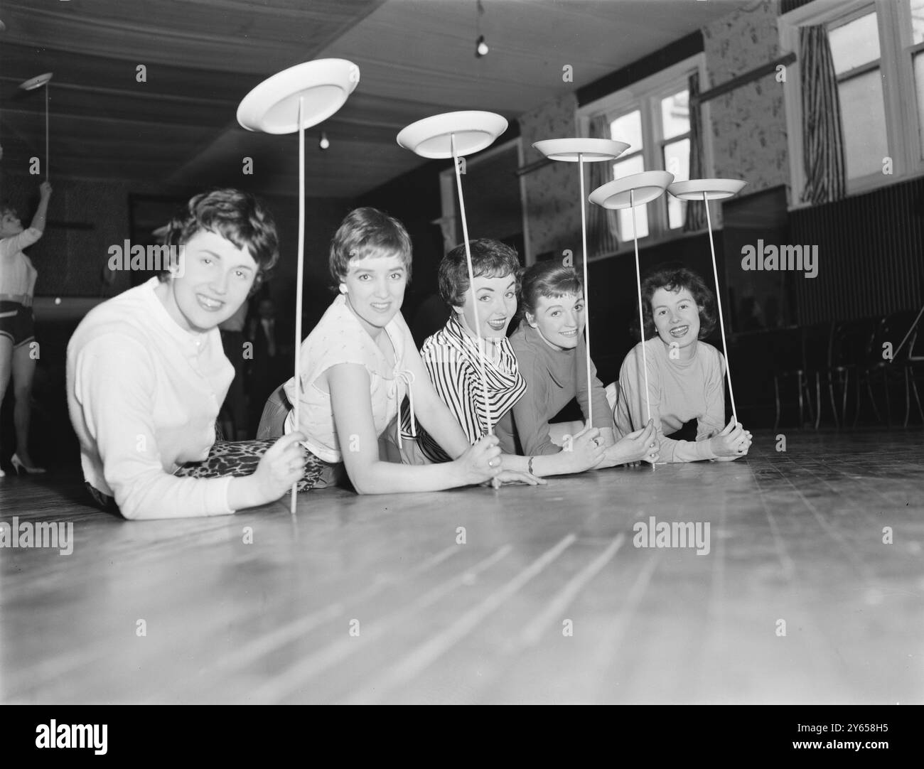 Whirly girls . London ; The lovely Vernon Girls are all in a whirl as ...