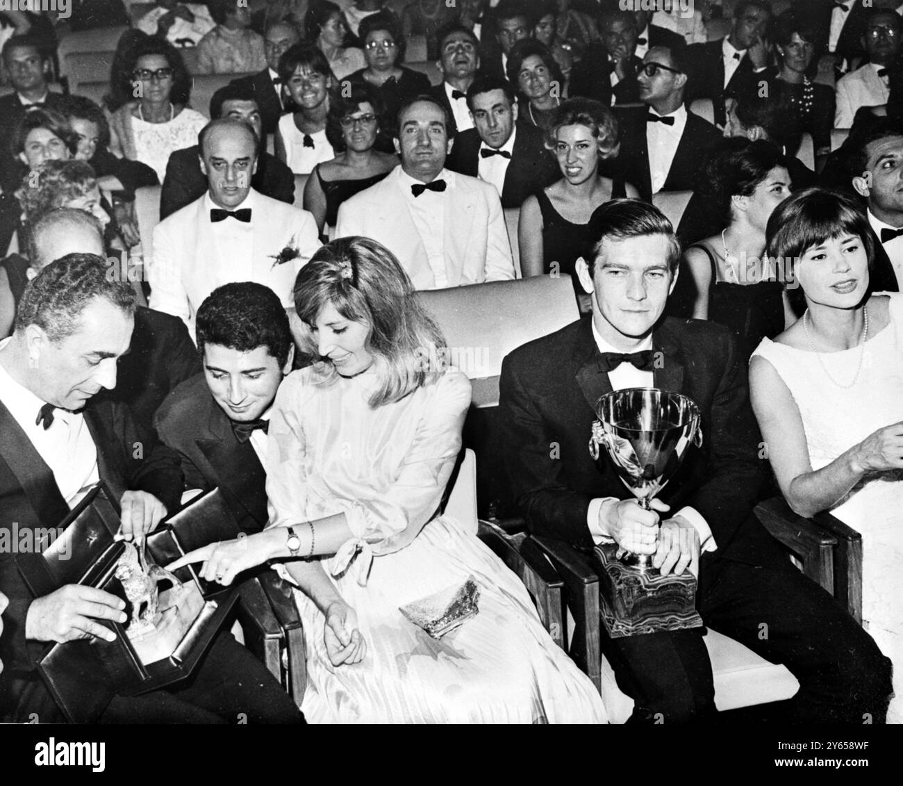 Pictured after receiving their winning awards at the Venice Film Festival are LtoR in front ...