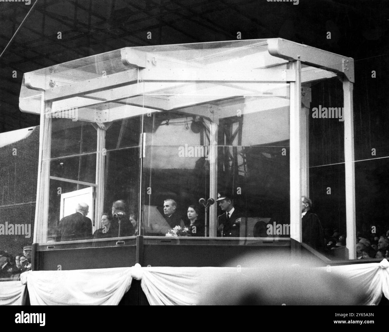 Queen launches her new Royal yacht . The Queen , with the Duke of ...