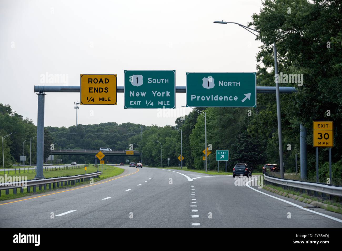 Directional signs at an intersection with arrows to Providence and New ...