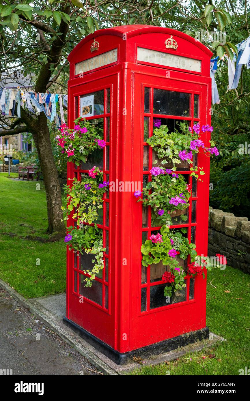 A decorated red phone box in Sabden the home of the Pendle witches ...