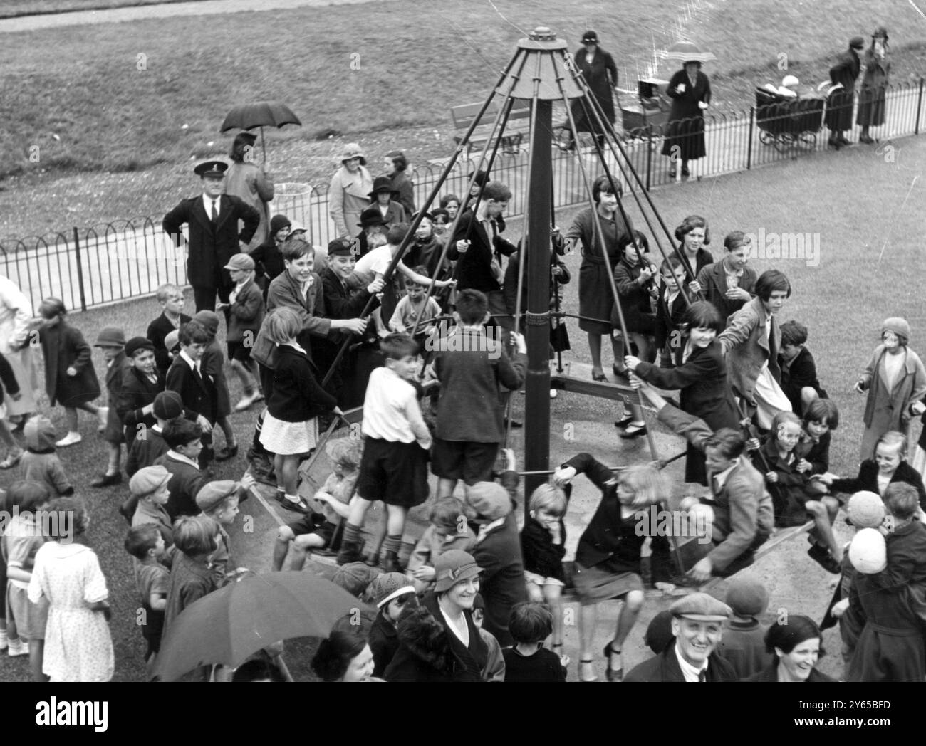 The children's playground roundabout , a popular place for children ...