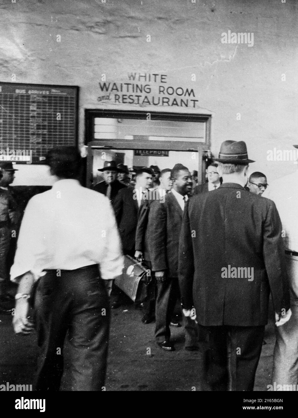 A group of four College professors and three black students being ...