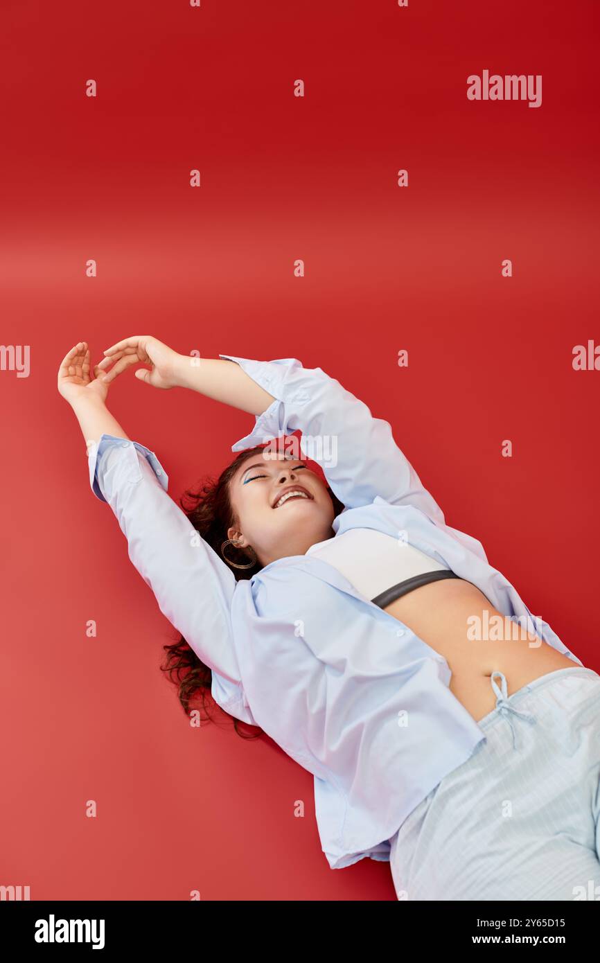 Delight shines as a young plus size woman elegantly poses with vibrant ...