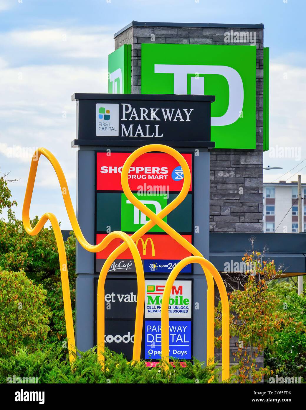 Contrast of an urban art sculpture and advertisement signs at the ...