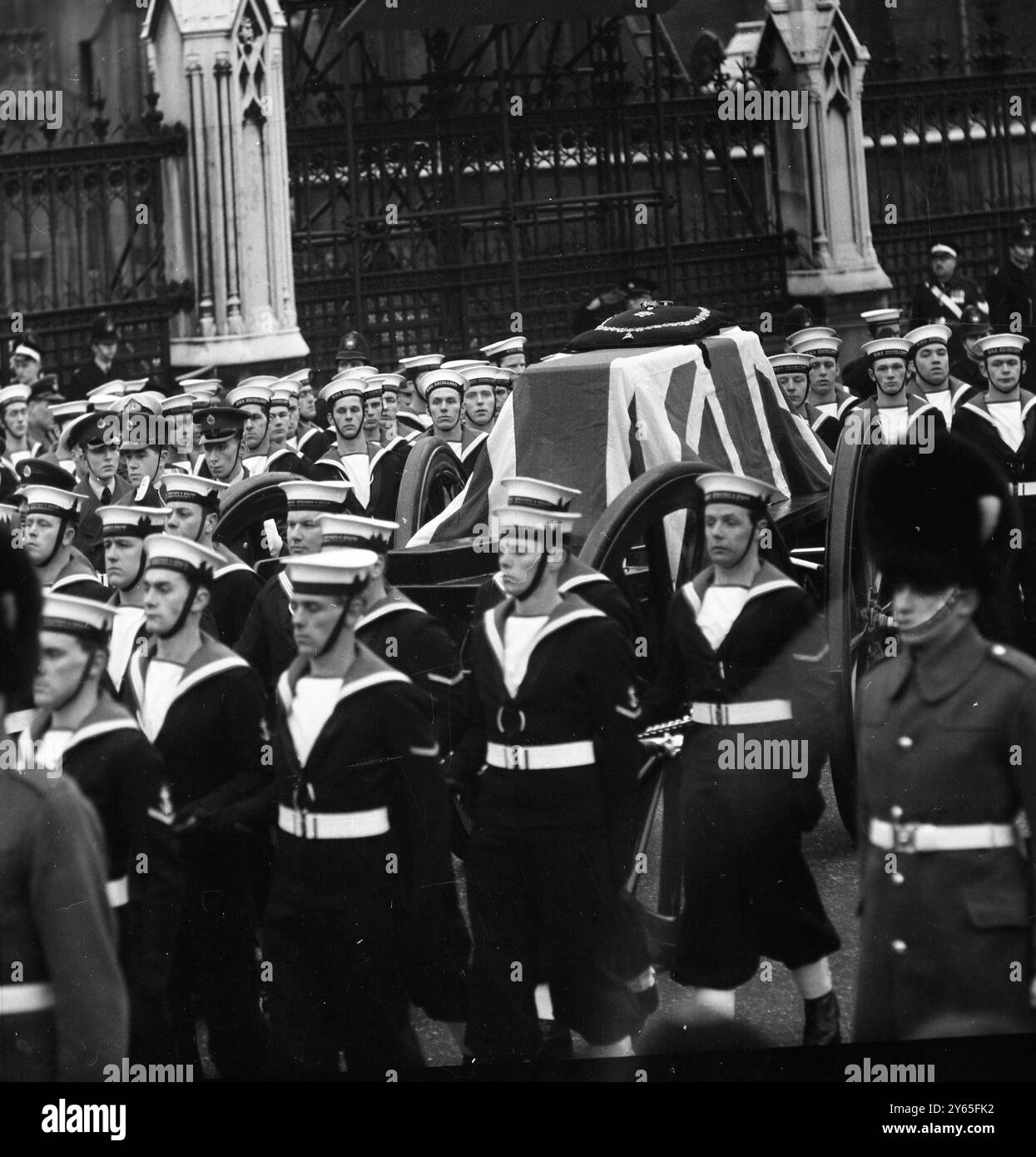 Final Journey The gun carriage bearing the flag draped coffin of Sir ...